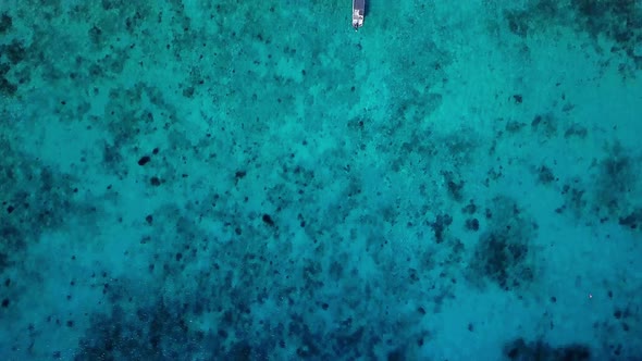 Overhead dolly in view of the pristine waters of Cas Abao Beach on the ...