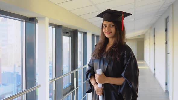 Pakistani Female Graduate in Mantle Stands with a Diploma in Her Hands ...