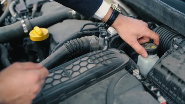Close Up Man Looks at the Idle Car Engine, Stock Footage | VideoHive