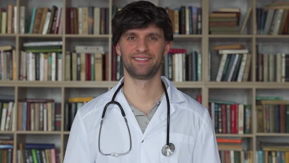 Young Woman Doctor in a Library Smiling Happy, Stock Footage | VideoHive