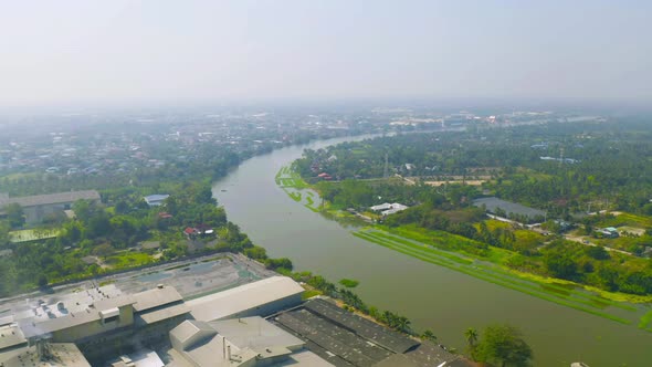 Aerial top view of curve of Chao Phraya River and forest trees and ...