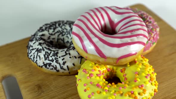 Rotating Donuts with Different Fillings on the Table, Stock Footage