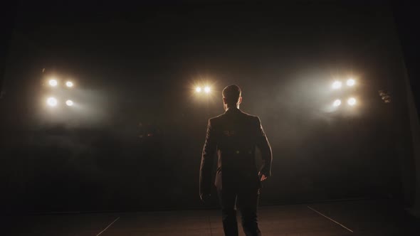 A Man is Coming on Stage and Raising His Hands, Stock Footage | VideoHive