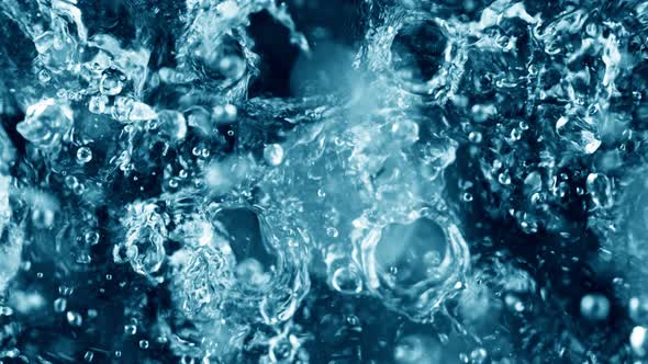 Super Slow Motion Shot of Many Water Drops Falling and Splashing on ...