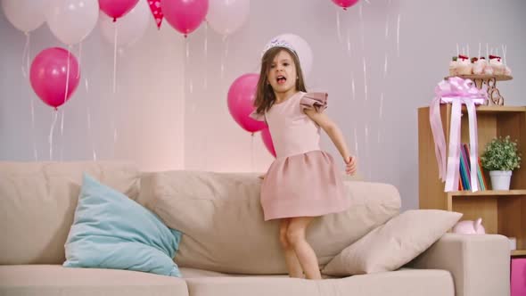 Little Princess Jumping on Sofa, Stock Footage | VideoHive