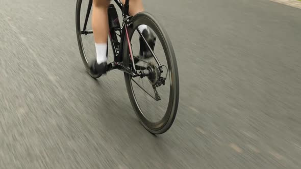 Cycling bicycle wheel rotation legs spinning pedals on bike, Stock Footage