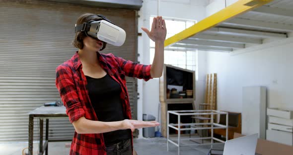 Female welder using virtual reality headset 4k, Stock Footage | VideoHive
