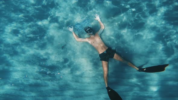 Young Boy Does Freediving Apnea Underwater Circular Bubbles in the ...