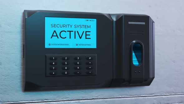 Security panel keypad on the wall. Screen showing the alarm being ...