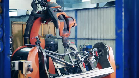 Modern Robotic Arm Welding Bike Frame Automatically, Stock Footage