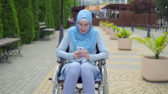 Young Attractive Muslim Woman in a Traditional Scarf Disabled in a ...