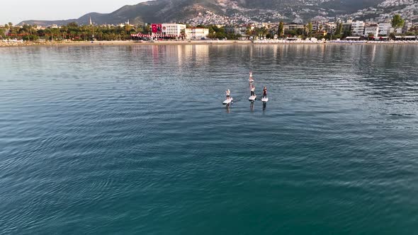 Sup surfing group aerial view 4 K Turkey Alanya, Stock Footage | VideoHive