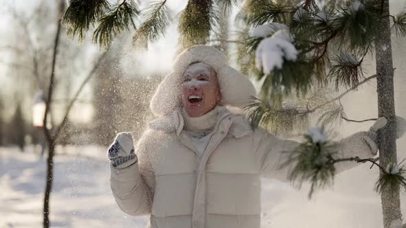 Funny Man is Playing with Snow in Forest Swaying Branch of Pine and ...