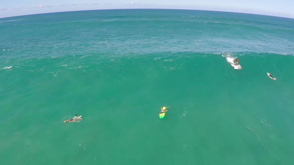 Aerial view of a man sup stand-up paddleboard surfing in Hawaii, Stock ...