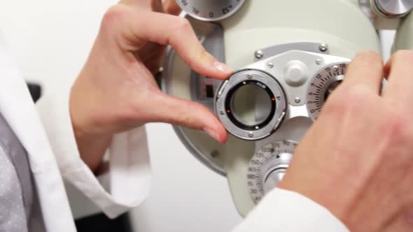 Female Optometrist Adjusting Chiropter, Stock Footage | VideoHive