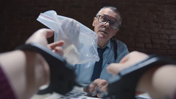 Experienced Investigator During Interrogation Showing Criminal Evidence ...