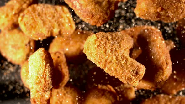 Chicken Nuggets Flying In The Air In Slow Motion On Black Background ...
