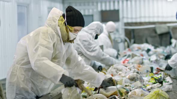 Workers in Protective Suits Sorting Plastic Waste, Stock Footage ...