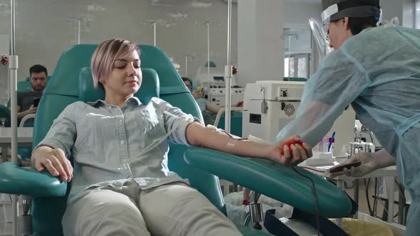 Girl Giving Blood at Collection Center, Stock Footage | VideoHive