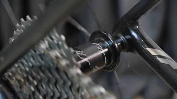 Bicycle wheel rotating. Bicycle gear and chain in motion, close up ...