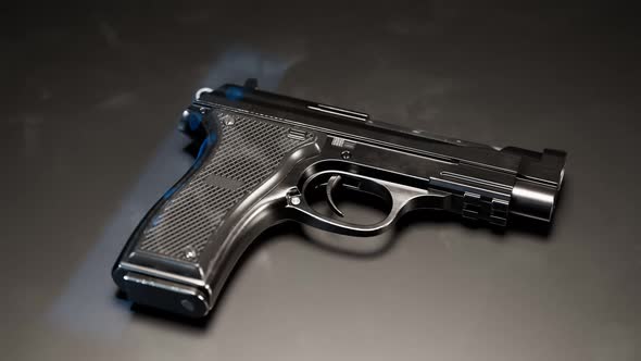 Gun with fingerprints in UV light. Biometric identification in ...