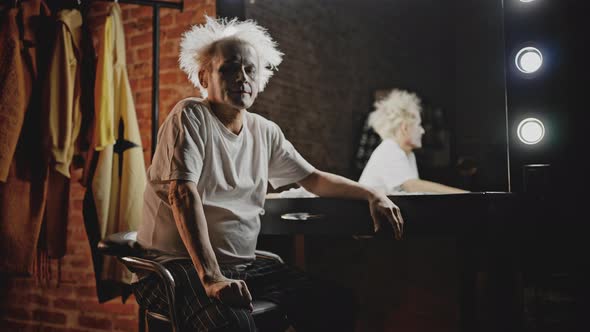 Professional Actor Feels Exhausted Sitting Against Mirror, Stock Footage
