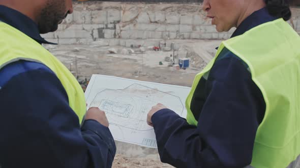 Workers Discussing Blueprint in Quarry, Stock Footage | VideoHive