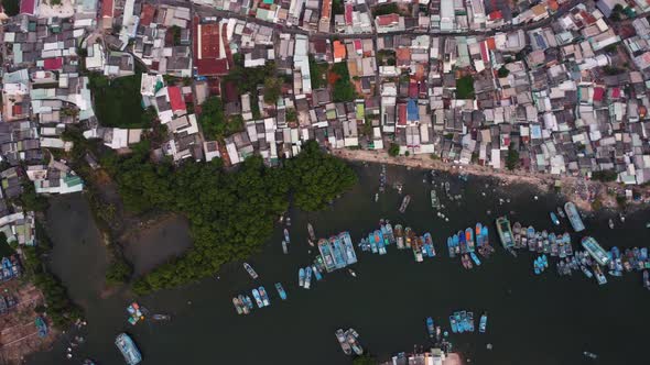 Phan Thiet harbor and overpopulated town in Vietnam, aerial top down ...