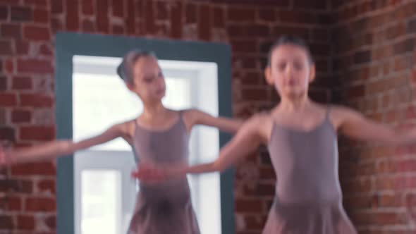 Two Ballerina Girls Performing Synchronized Basic Dancing in the Studio ...