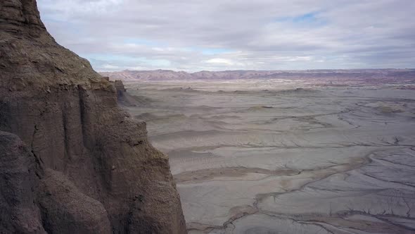Rising aerial view of rocky cliff in the desert, Stock Footage | VideoHive