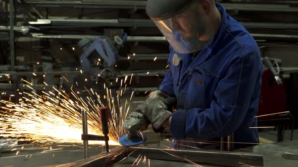 Workman welding metal construction in workshop, Stock Footage | VideoHive