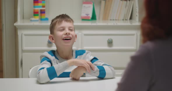 Child with Autism Laughing During Lesson with Autism Therapist, Stock ...