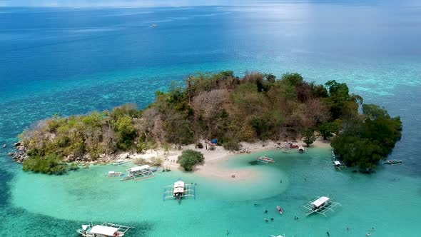 Aerial shot of boats docked at CYC beach CYC Island, Coron town ...