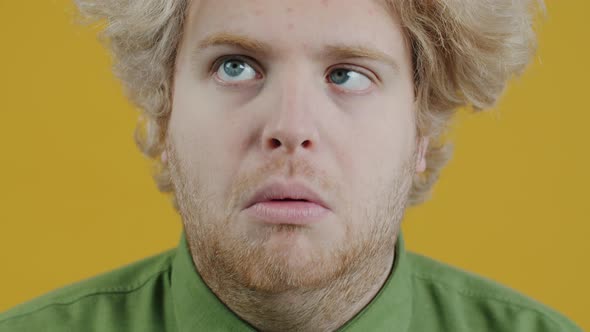 Closeup Portrait of Weird Guy Rolling Eyes and Making Funny Faces on ...