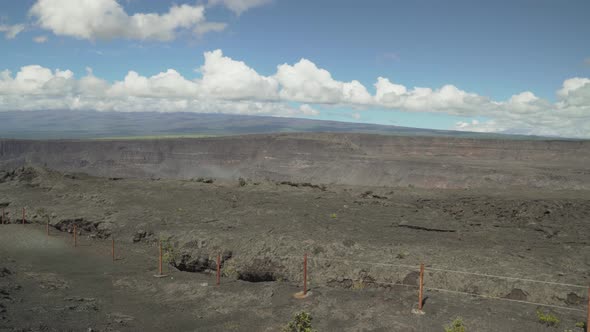 Steam and smoke rising from volcano crater with picturesque clouds in ...