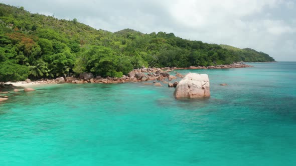 Aerial dolly slider to Indian ocean coastline of bay Baie Chevalier ...