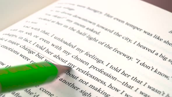 Close Up of Pencil Underlining Important Information in Book, Stock Footage