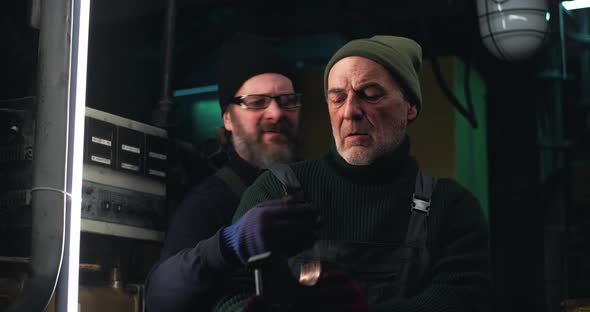 Dissatisfied Mechanics Examining Detail, Stock Footage | VideoHive