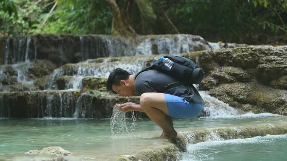 Man Washing His Face In Wild River, Stock Footage | VideoHive