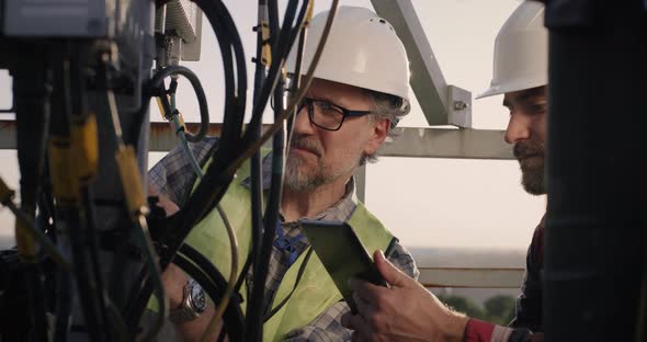 Engineers Working on a Cellular Tower, Stock Footage | VideoHive