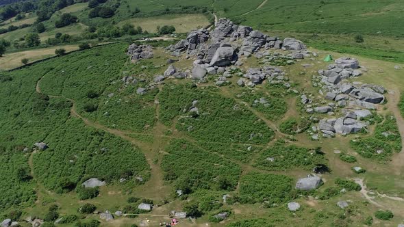 Wide shot aerial tracking forward over Bonehill Rocks, Dartmoor, Devon ...
