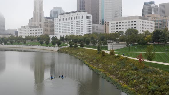 Kayaking in downtown Columbus, Ohio on the Scioto River on a misty day ...