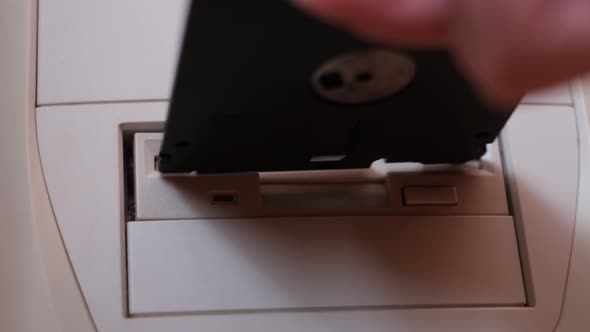 Closeup of Installing Floppy Disk in Retro Computer, Stock Footage