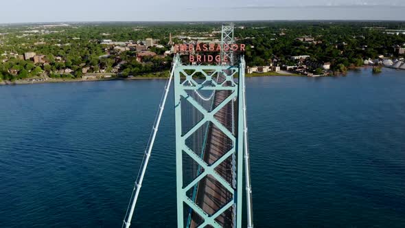 Sweeping aerial views of the Ambassador Bridge in Detroit, Michigan ...