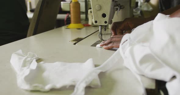African man sewing tissue, Stock Footage | VideoHive
