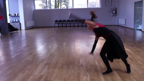 Slow motion professional and passionate female dancer does a flip over ...