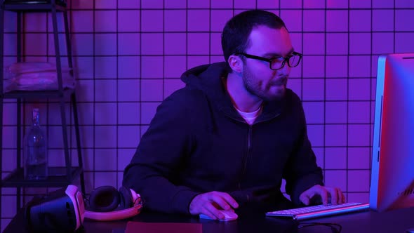 Tired Programmer Looking at Some Process on the Computer, Stock Footage