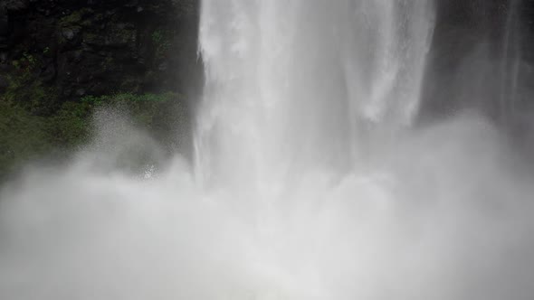 Close up shot of a waterfall crashing down into a body of water, Stock ...