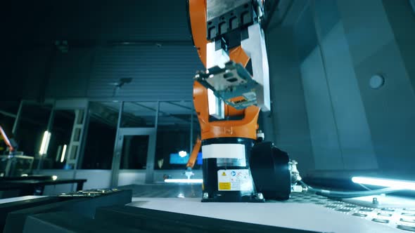 Low Angle View of Kuka Robot Manipulations with Microchip by ABC-video