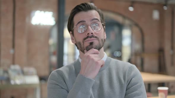 Portrait of Pensive Young Man Thinking, Stock Footage | VideoHive